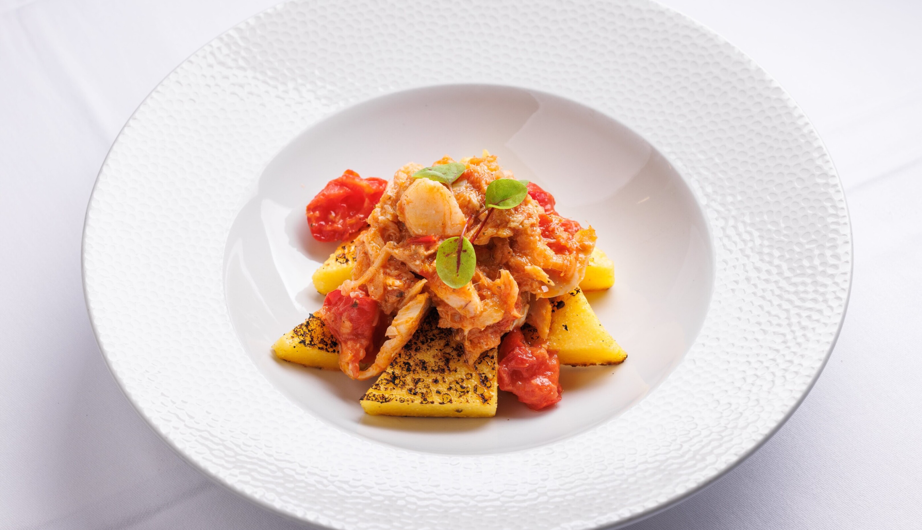 Polenta with bakala in tomato sauce | Izola